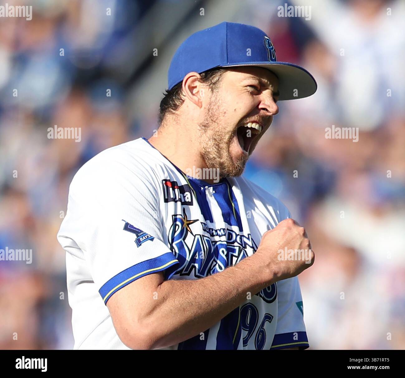 Yokohama DeNA Baystars starting pitcher Trevor Bauer reacts after the left fielder Tatsuo Ebina ...