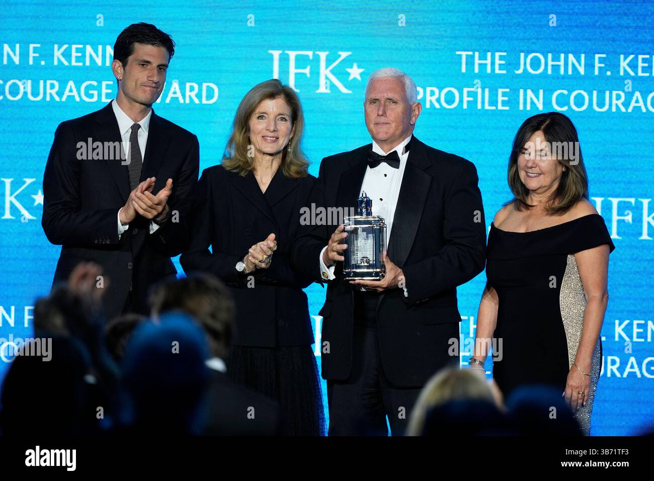 Former Vice President Mike Pence, with his wife, Karen Pence, far right ...