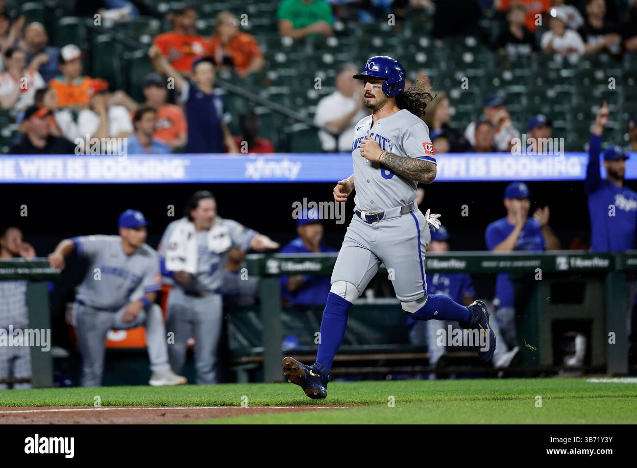 Kansas City Royals' Jonathan India scores a run on single hit by Maikel ...