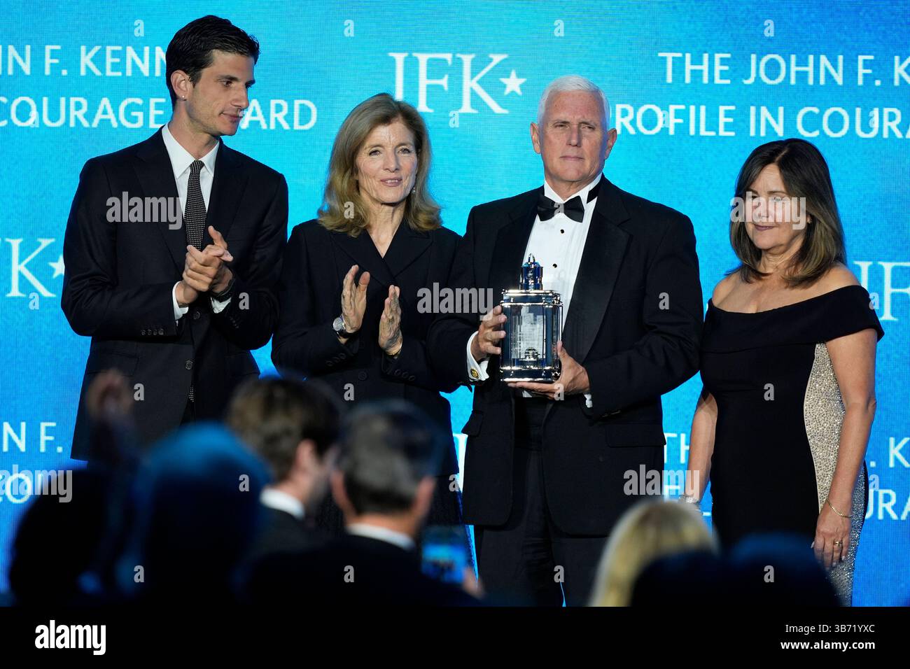 Former Vice President Mike Pence, second from right, stands with his ...