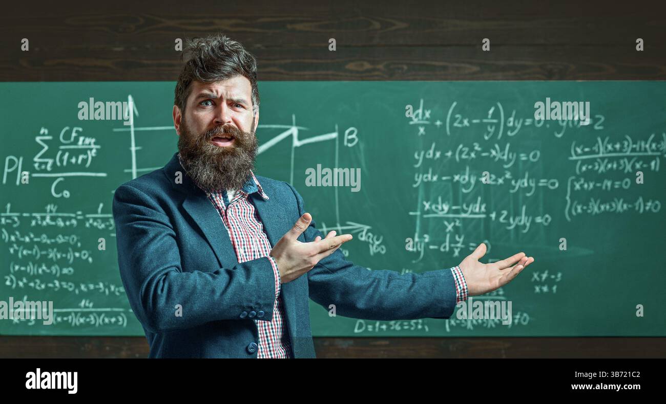 Teacher explains math in class. Professor in classroom on math lesson ...