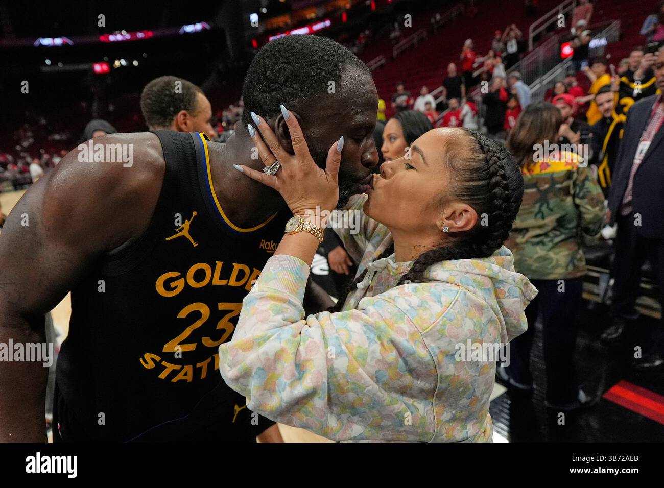 Golden State Warriors' Draymond Green (23) kisses his wife, Hazel Renee ...