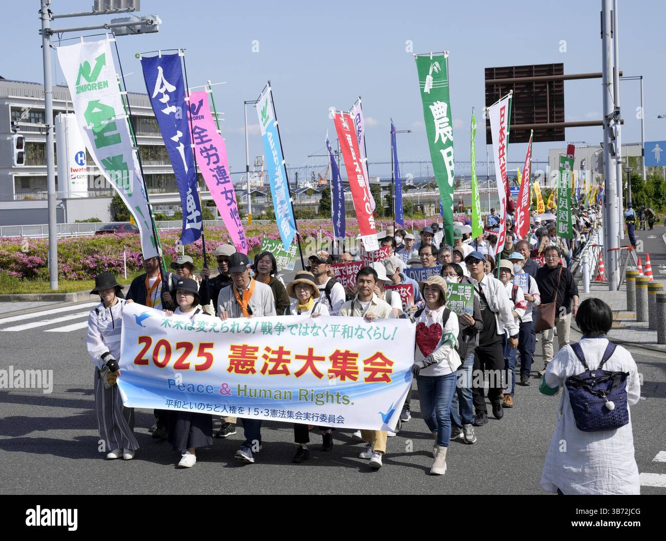 People march in support of protecting the current Japanese Constitution ...