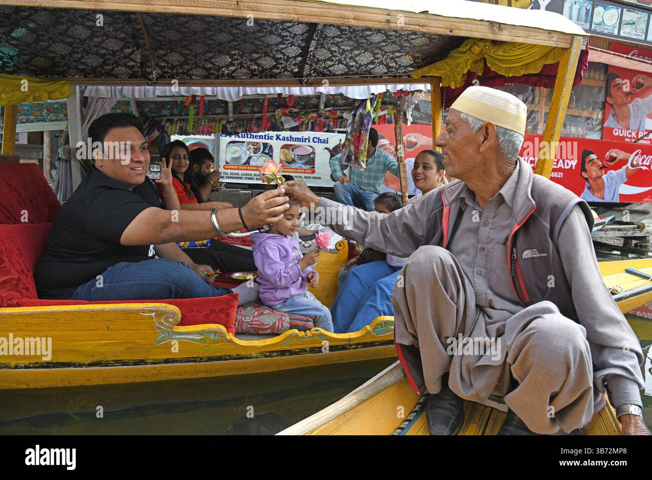 Srinagar, Jammu And Kashmir, India. 5th May, 2025. A boatman offers ...