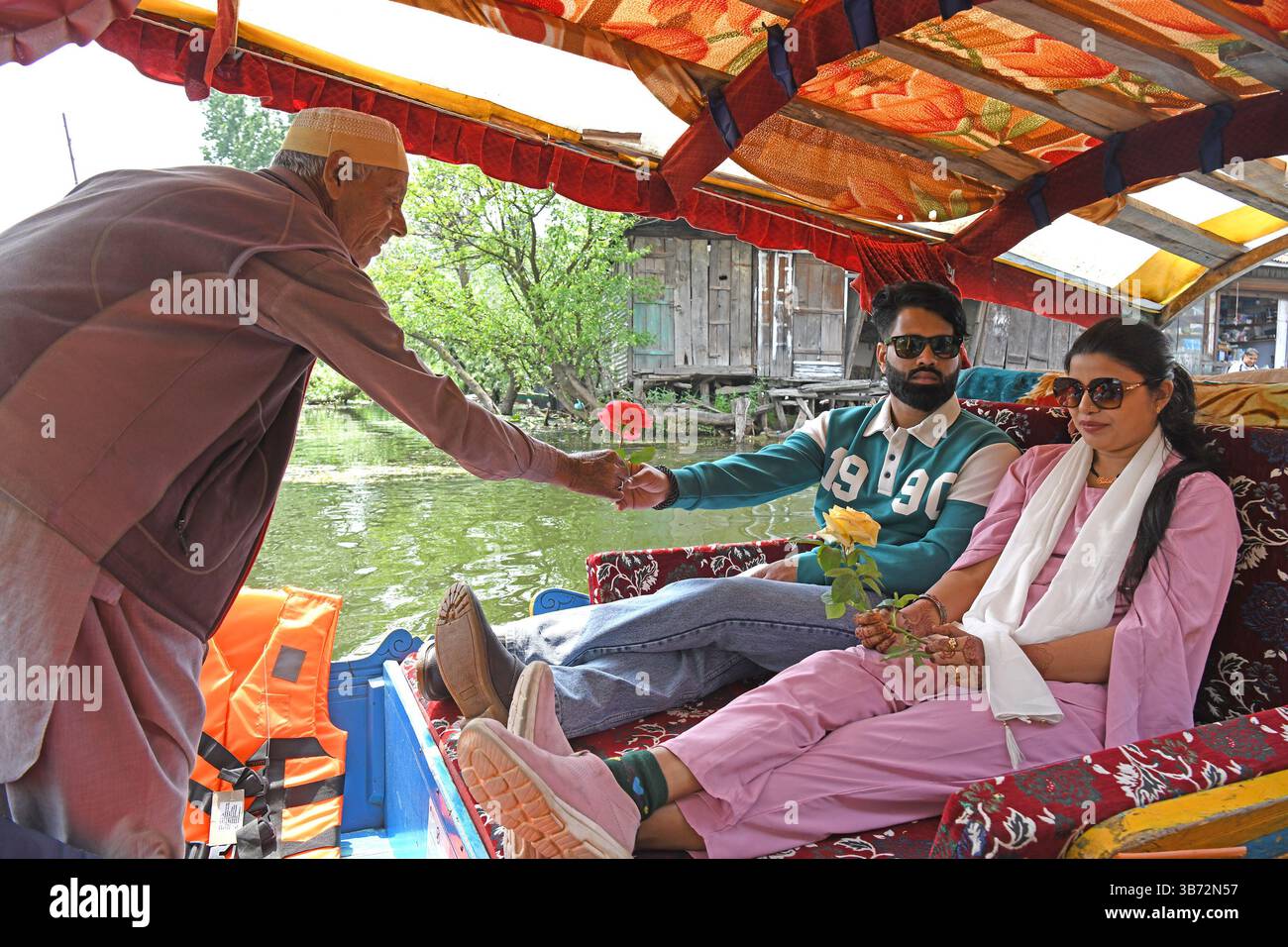Srinagar, Jammu And Kashmir, India. 5th May, 2025. A boatman offers ...