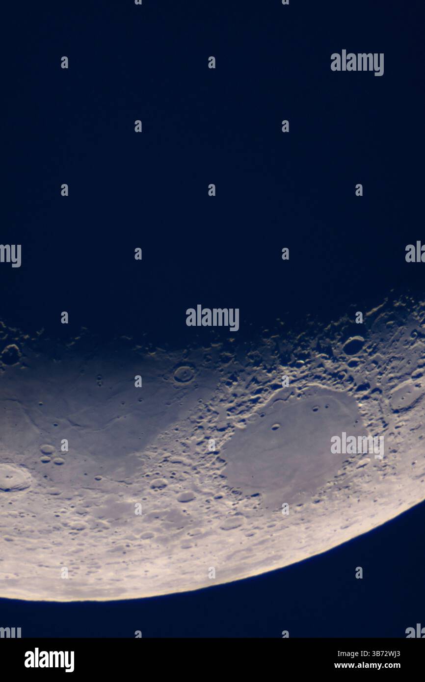 Crescent Moon features large crater floor and shadowed rim. Moon’s ...