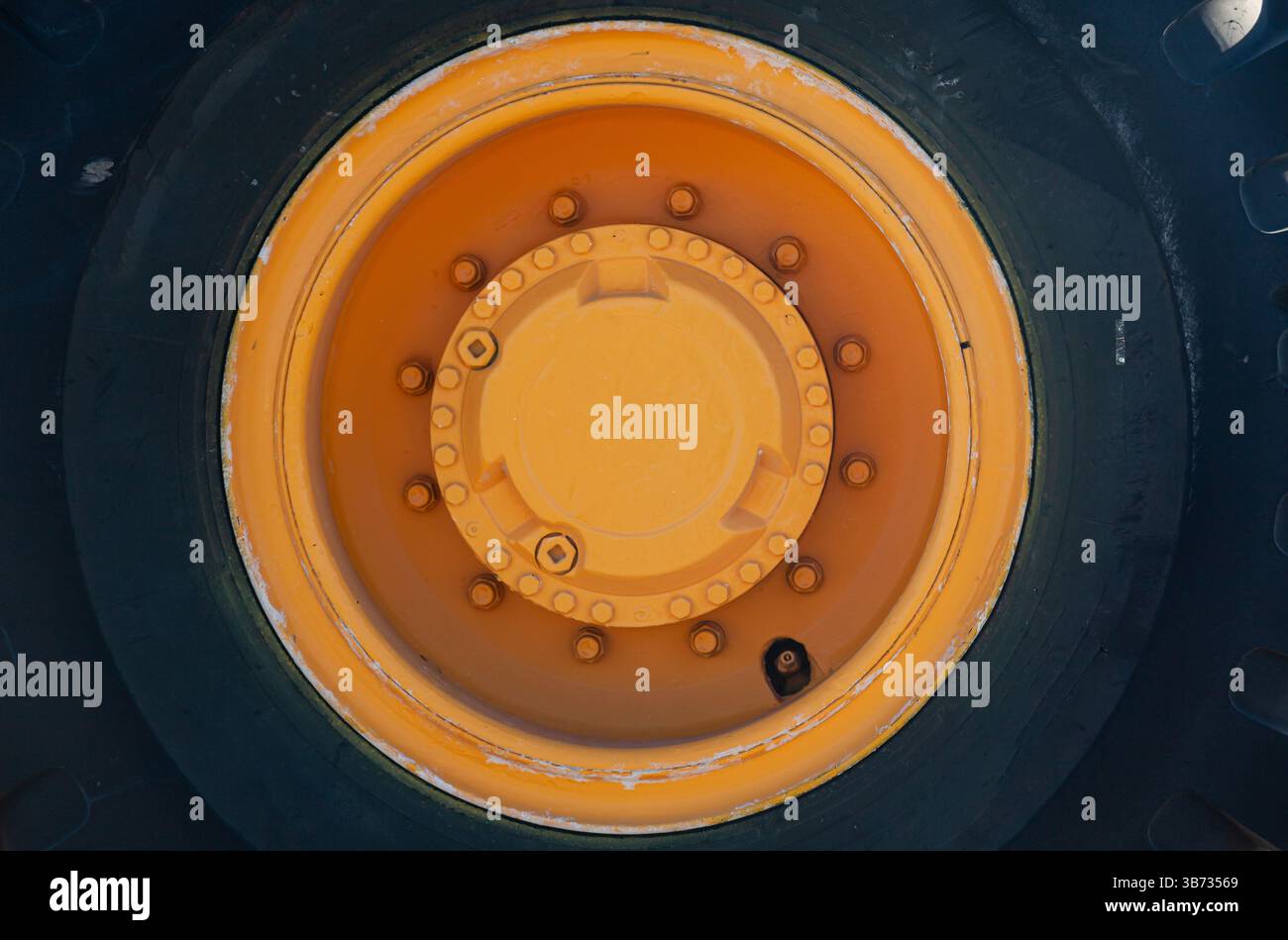 Wheel of heavy wheeled equipment. Excavator wheel with yellow disc ...