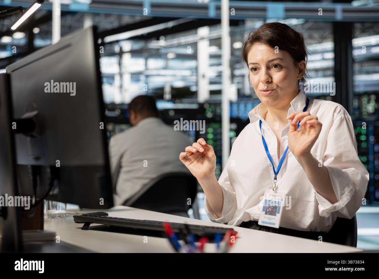 Data center technician inspecting gear, doing maintenance tasks ...