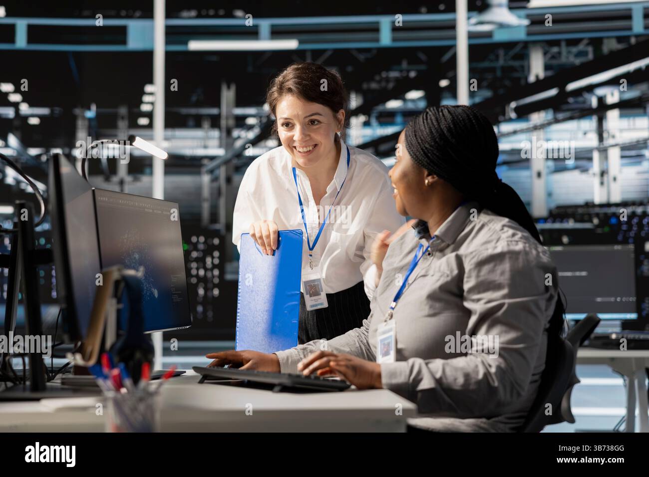 Teamworking colleagues in server hub pleased after successful operations. Happy data center ...