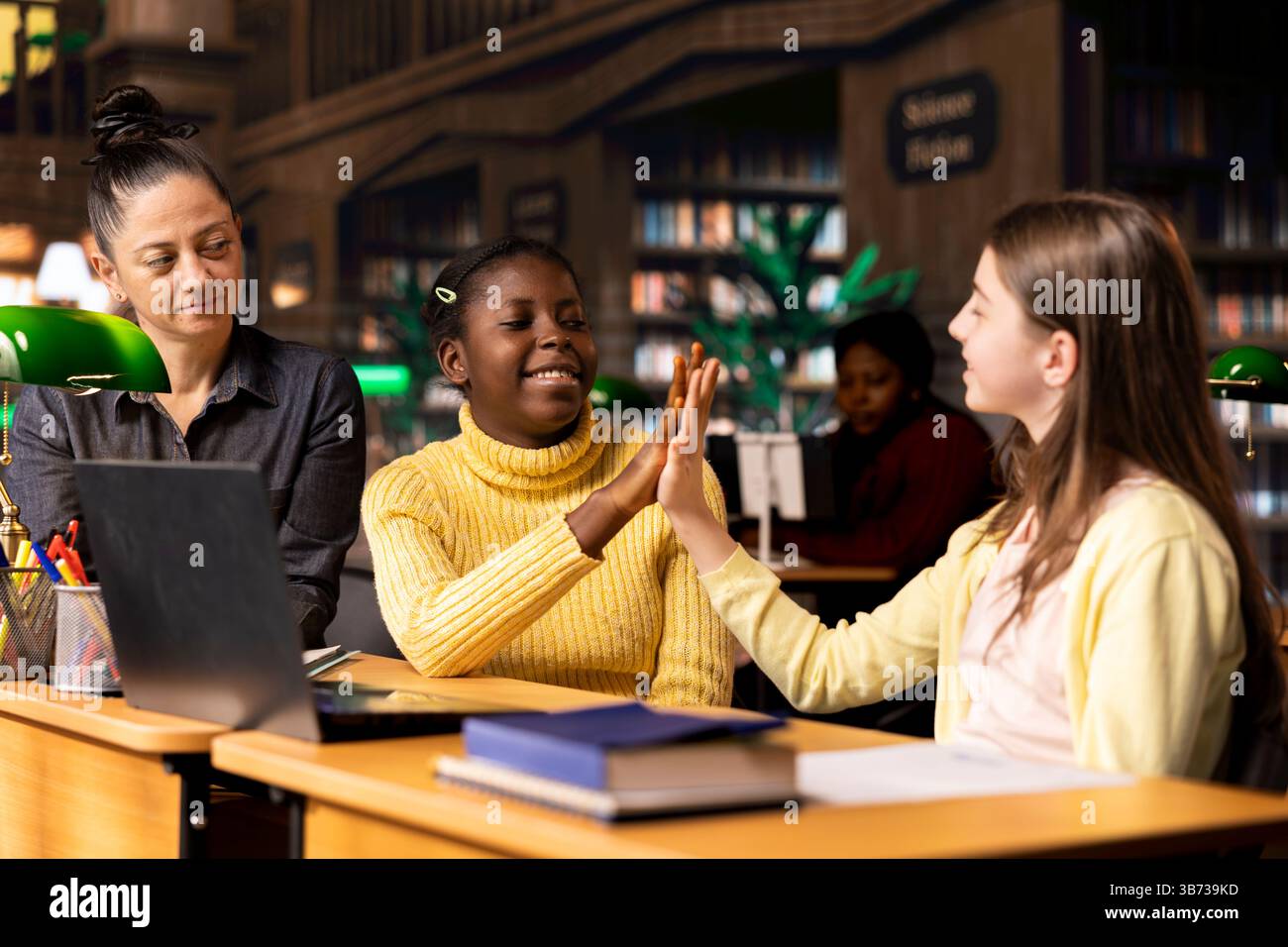 Diverse classmates sharing high five hi-res stock photography and ...
