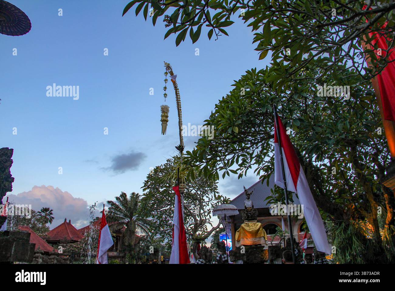 Ubud, Bali - 04.22.2025: Festival flags and temple decor line a ...