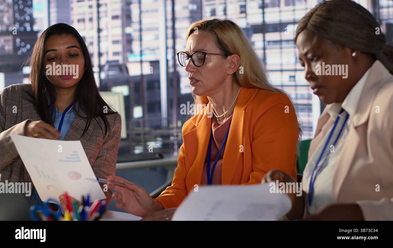 Female executives strategizing for a new project in inclusive business ...