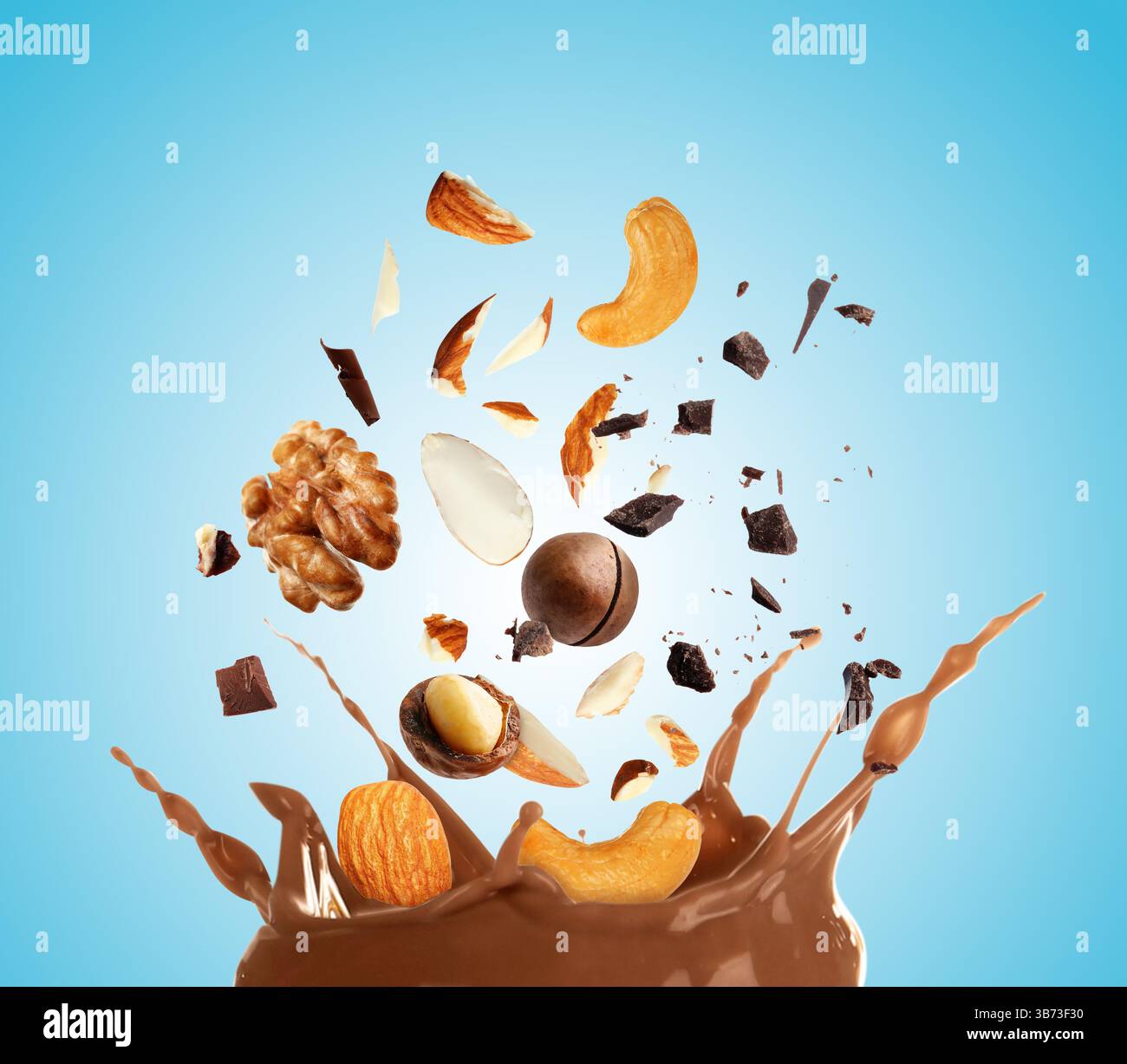 Chocolate splash with nuts on light blue background Stock Photo - Alamy