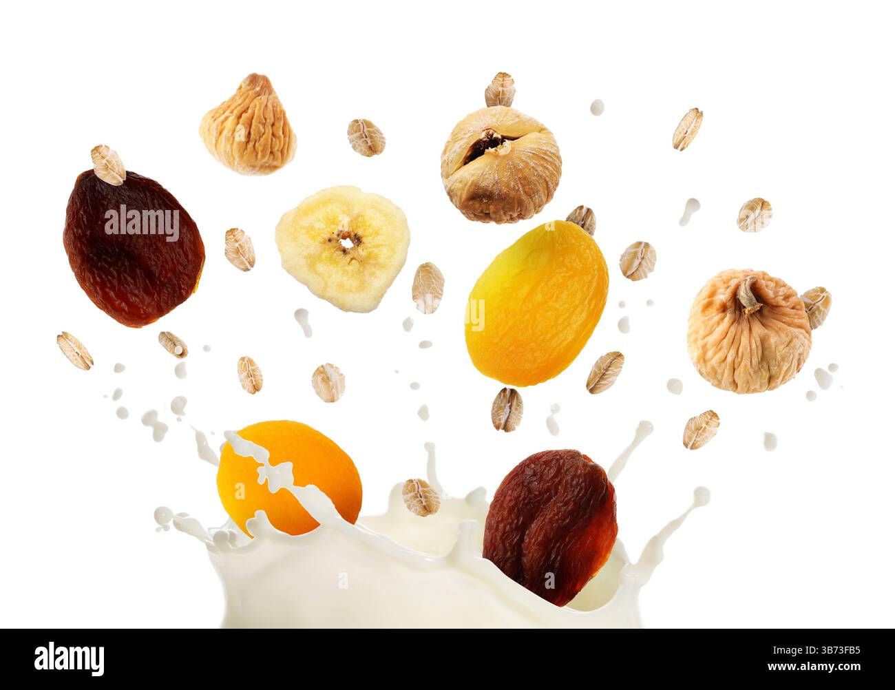 Milk splash with oat flakes and dried fruits in air on white background ...