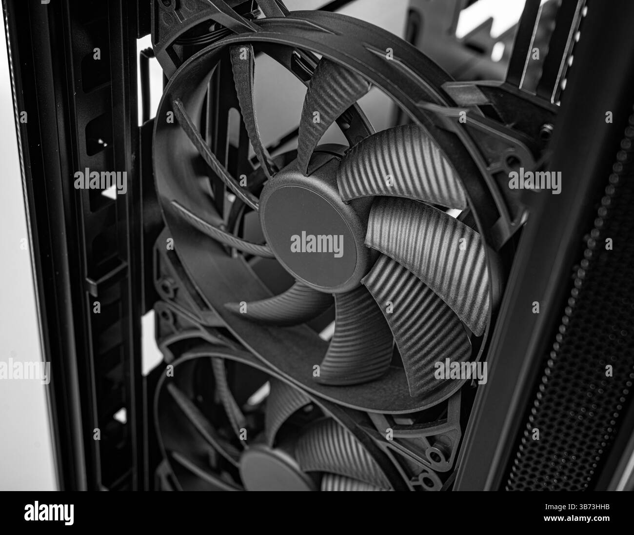 Two large PC cooling fans mounted vertically inside a computer case ...