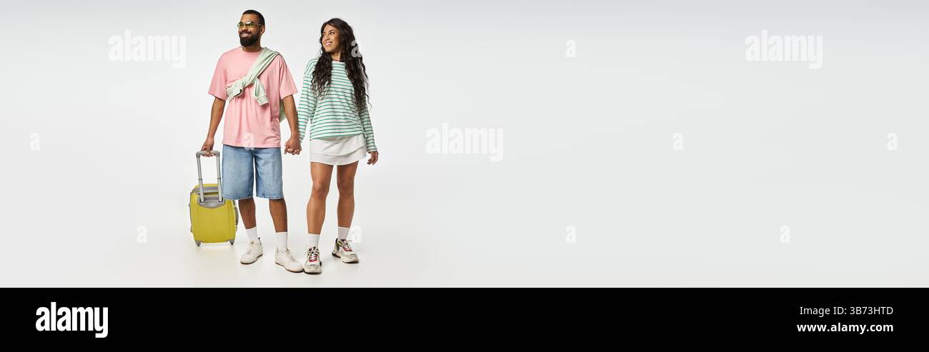 Fashionable duo stands cheerfully, showcasing their trendy outfits ...