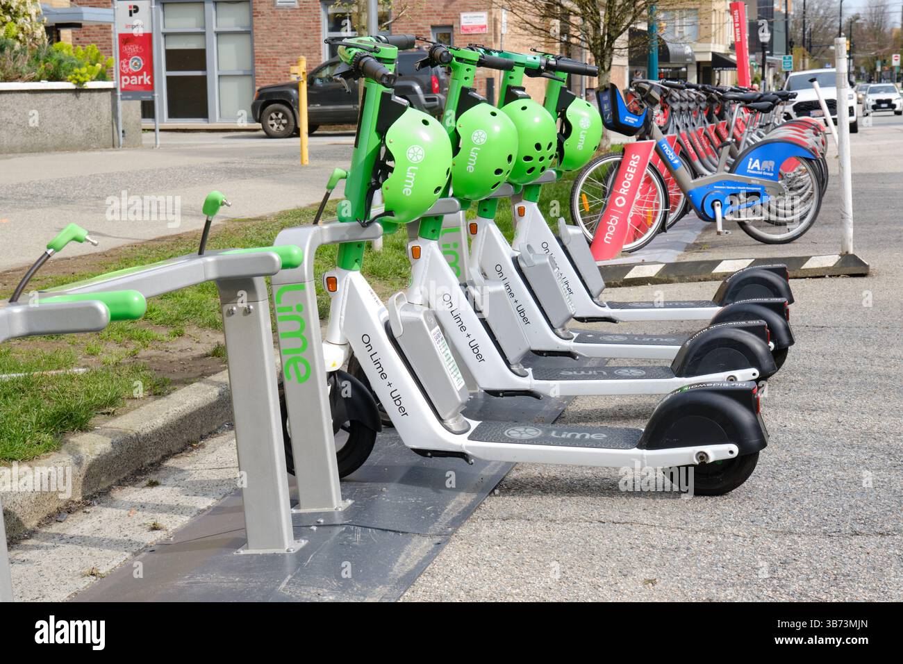 On Lime e-Scooter sharing docking station in Vancouver, BC 2025 Stock ...
