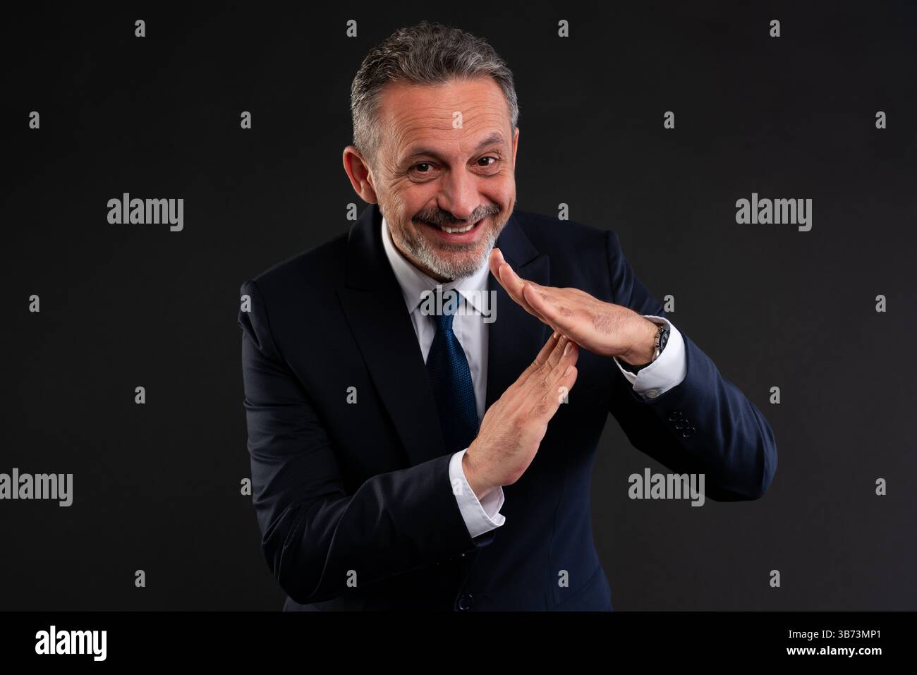 Man in suit making pause sign hi-res stock photography and images - Alamy