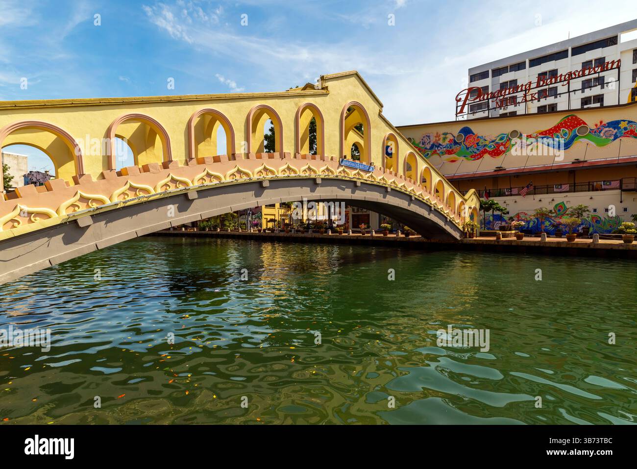 An arch shape bridge over the Malacca river. Malacca City UNESCO World ...