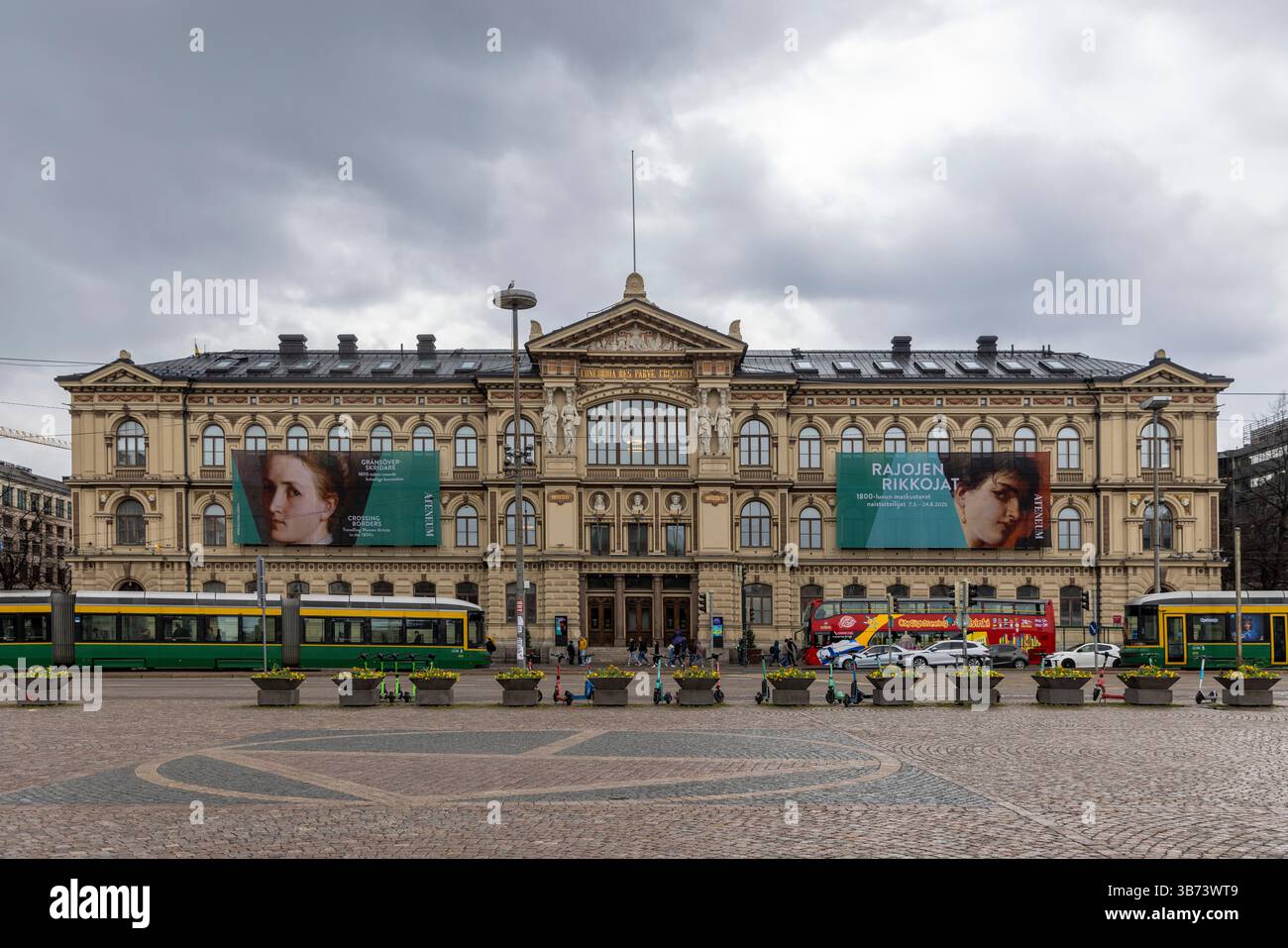 A famous art museum and tourists downtown Helsinki on an overcast ...