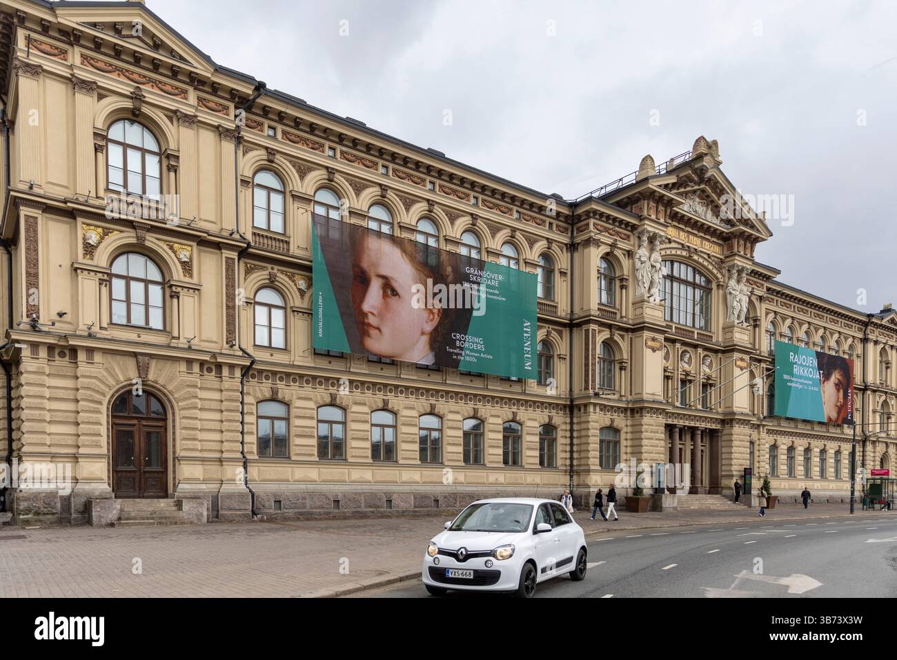 A famous art museum and tourists downtown Helsinki on an overcast ...
