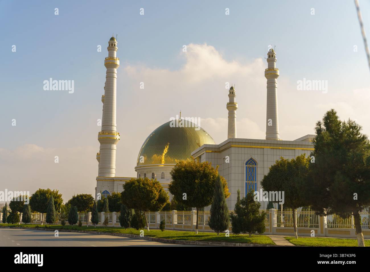 A large white building with gold trim and a dome sits in front Stock ...