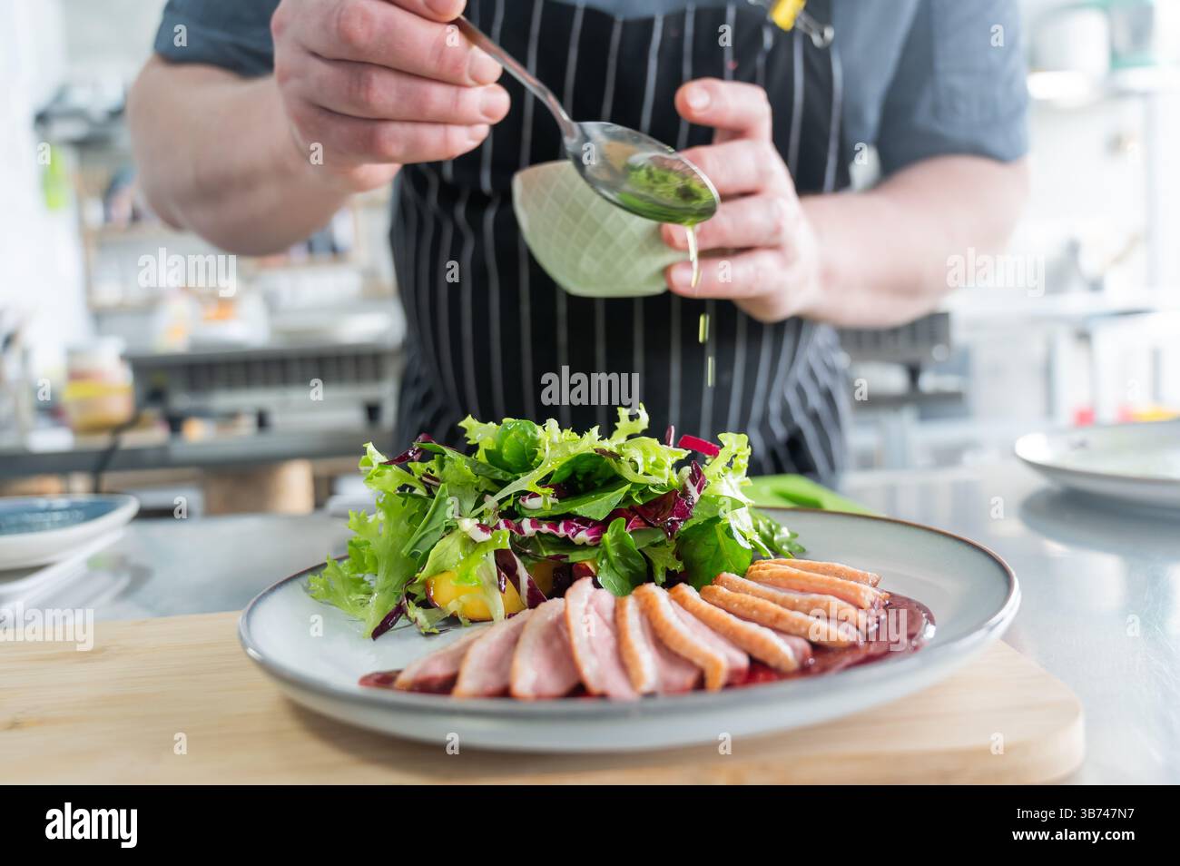 The chef serves roast duck Stock Photo - Alamy