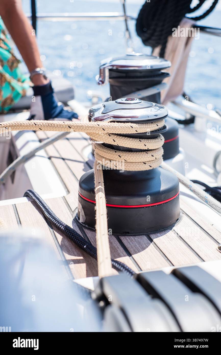 Sailing yacht ropes and winch. Sailboat equipment details. Water ...
