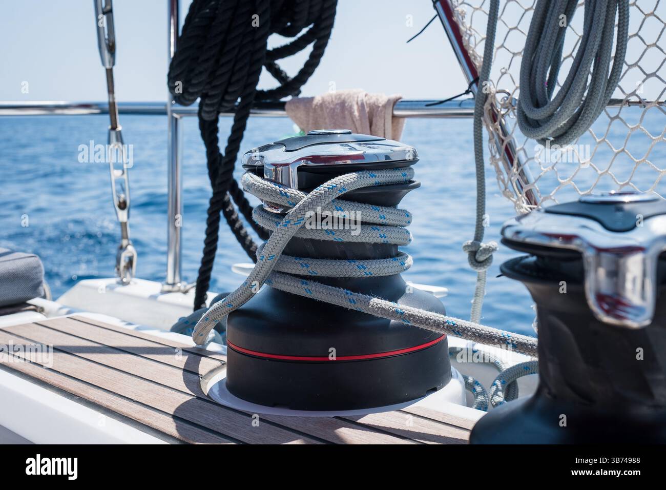 Sailing yacht ropes and winch. Sailboat equipment details. Water ...