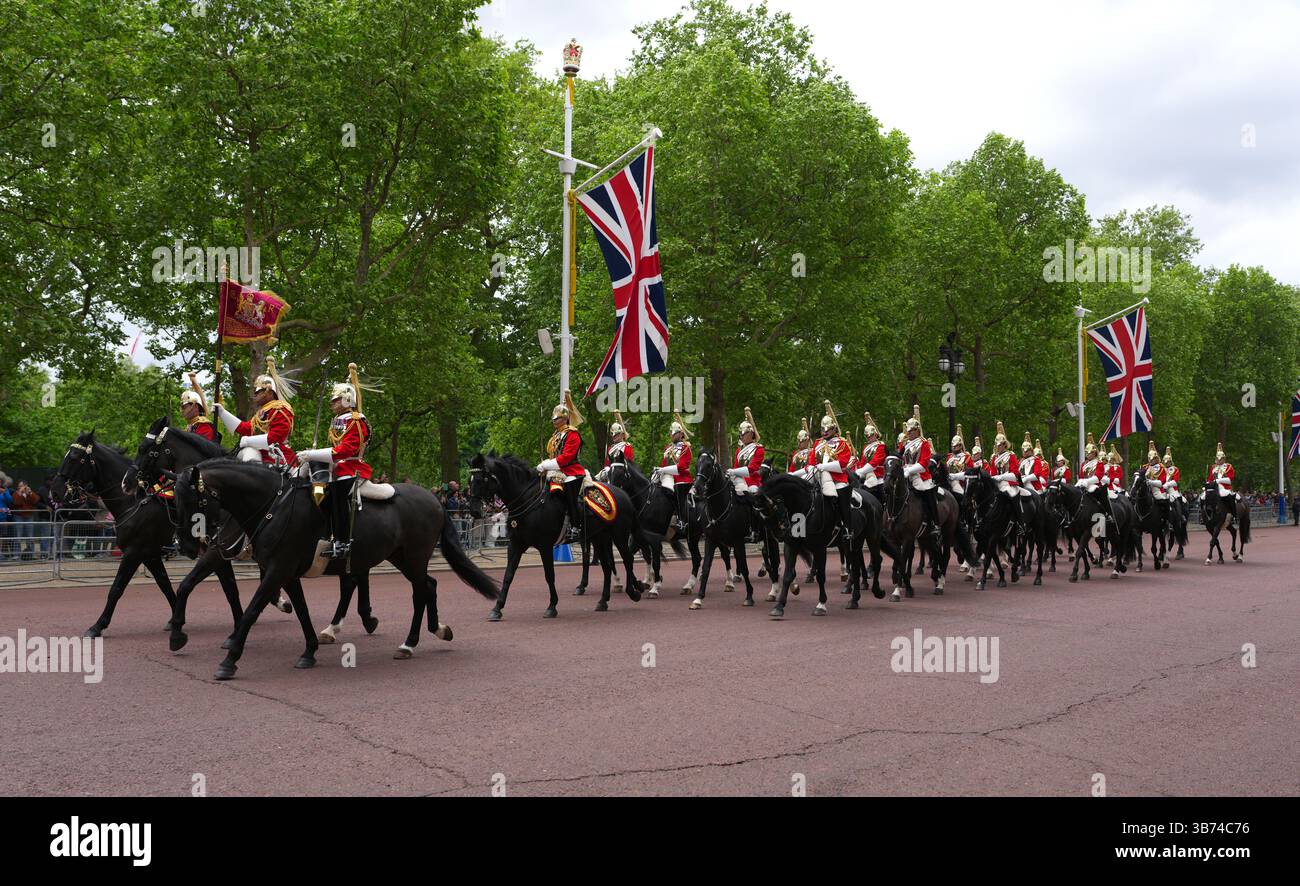 Members of the Household Cavalry Regiment parade on The Mall ahead of a ...