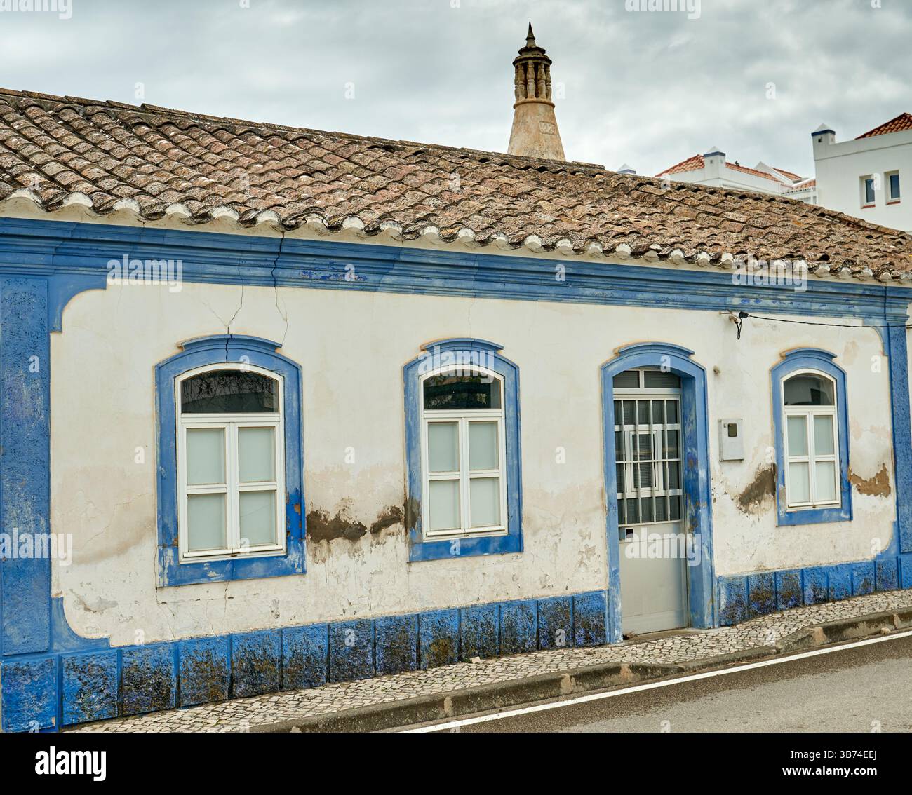 Traditional house with painted exterior and distinctive Algarve Chimney ...