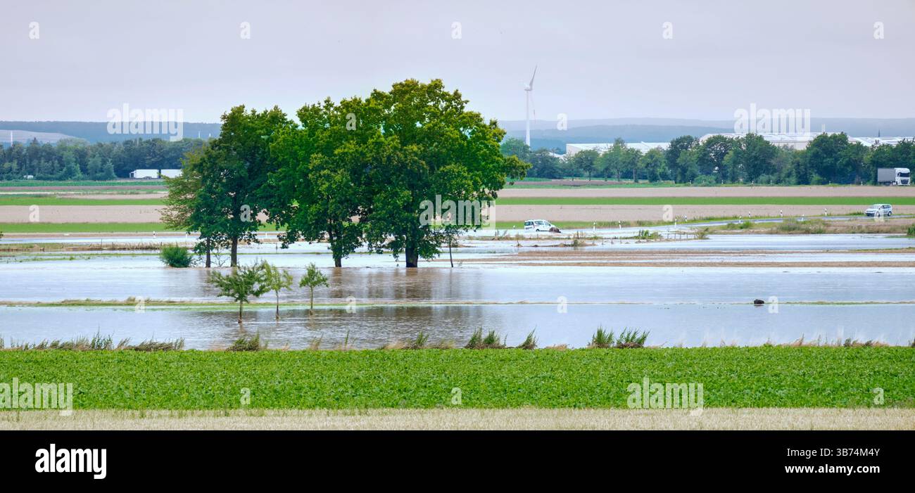 Fields are submerged under water as trees emerge from the flooding. The ...