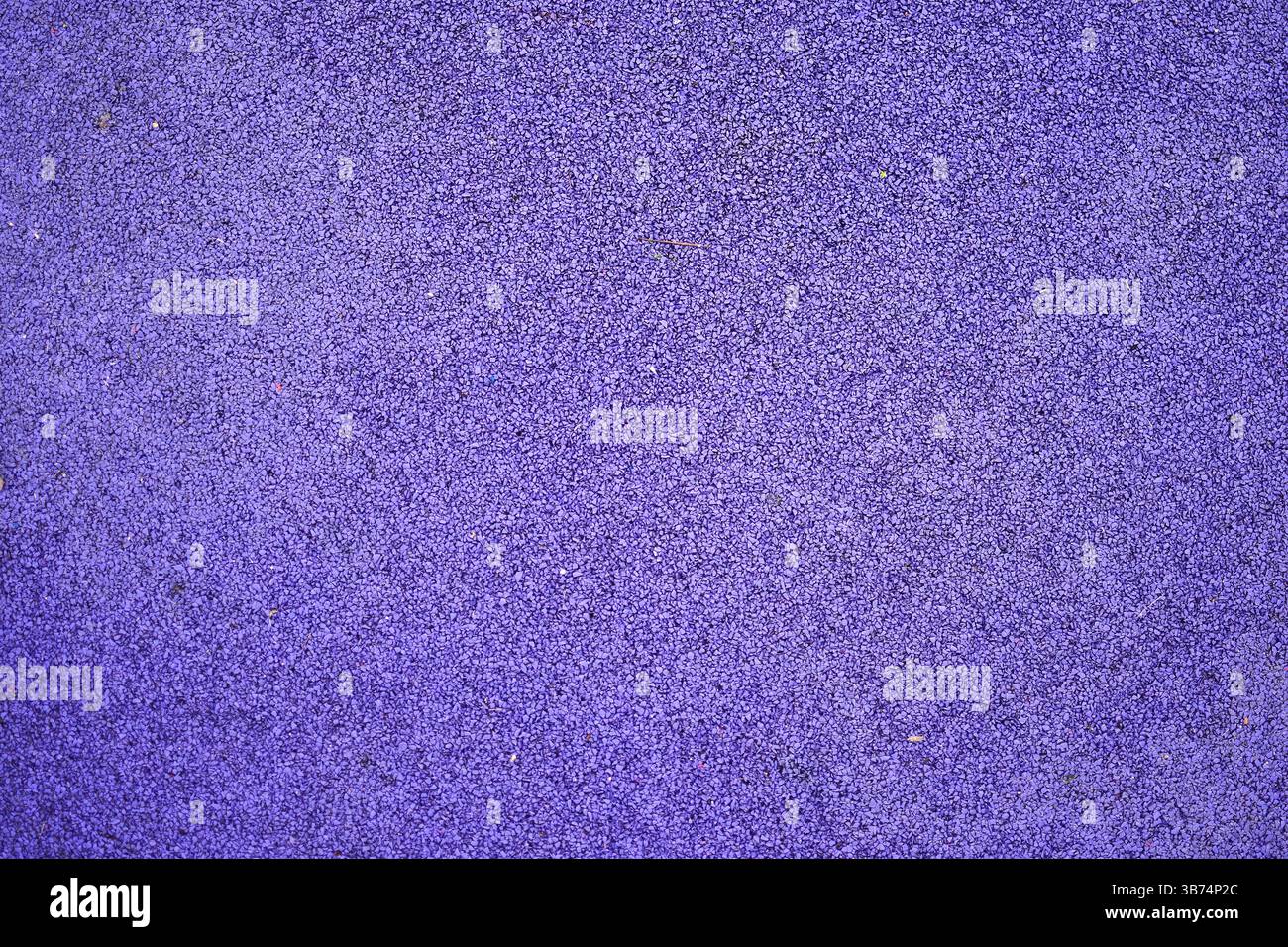 purple sports field rubber coating close up. Playground paving ...