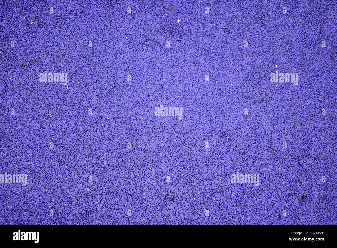 purple sports field rubber coating close up. Playground paving ...