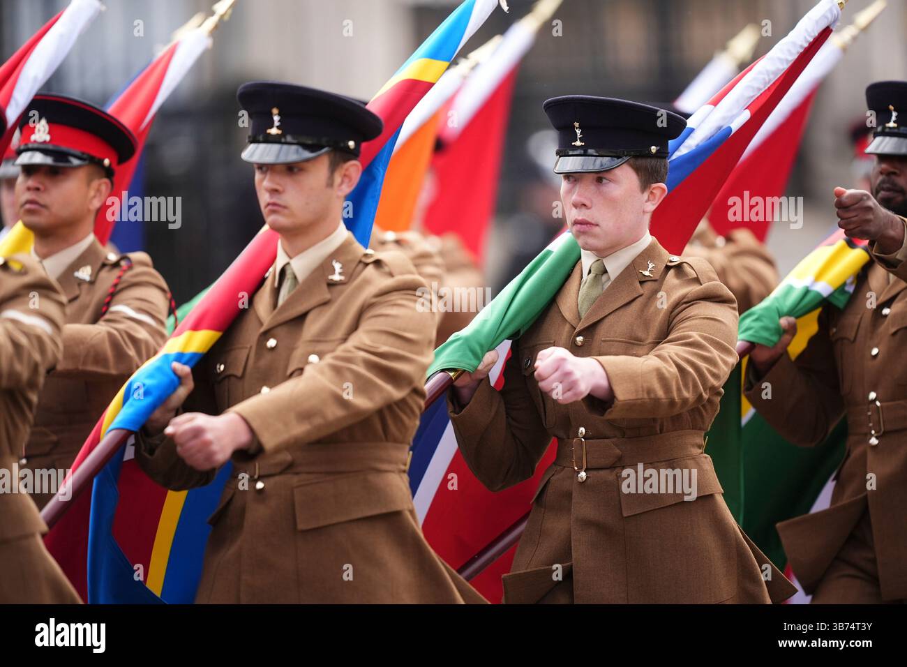 Members of the Colour Party carry flags of the Commonwealth nations ...