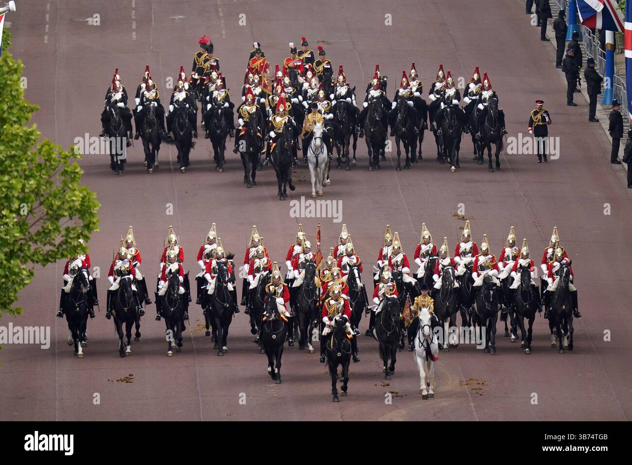 Members of the armed forces ride, during the VE Day 80th anniversary ...