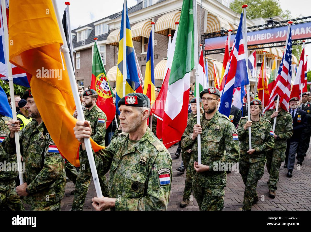 WAGENINGEN - Flag bearers during the annual Liberation Day parade in ...