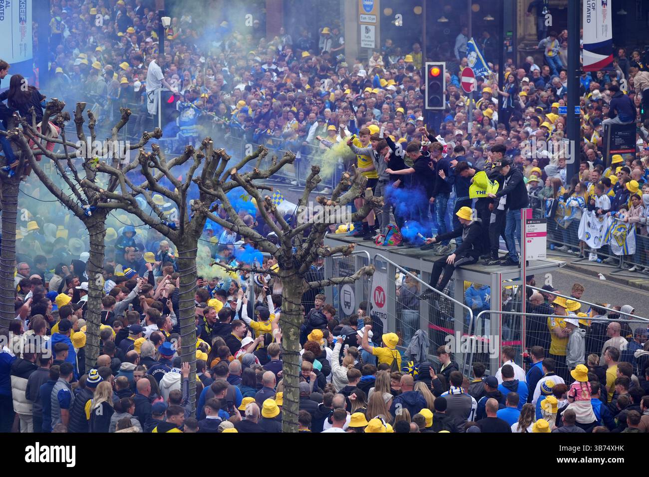 Leeds United fans lining the parade route in the city centre before the ...