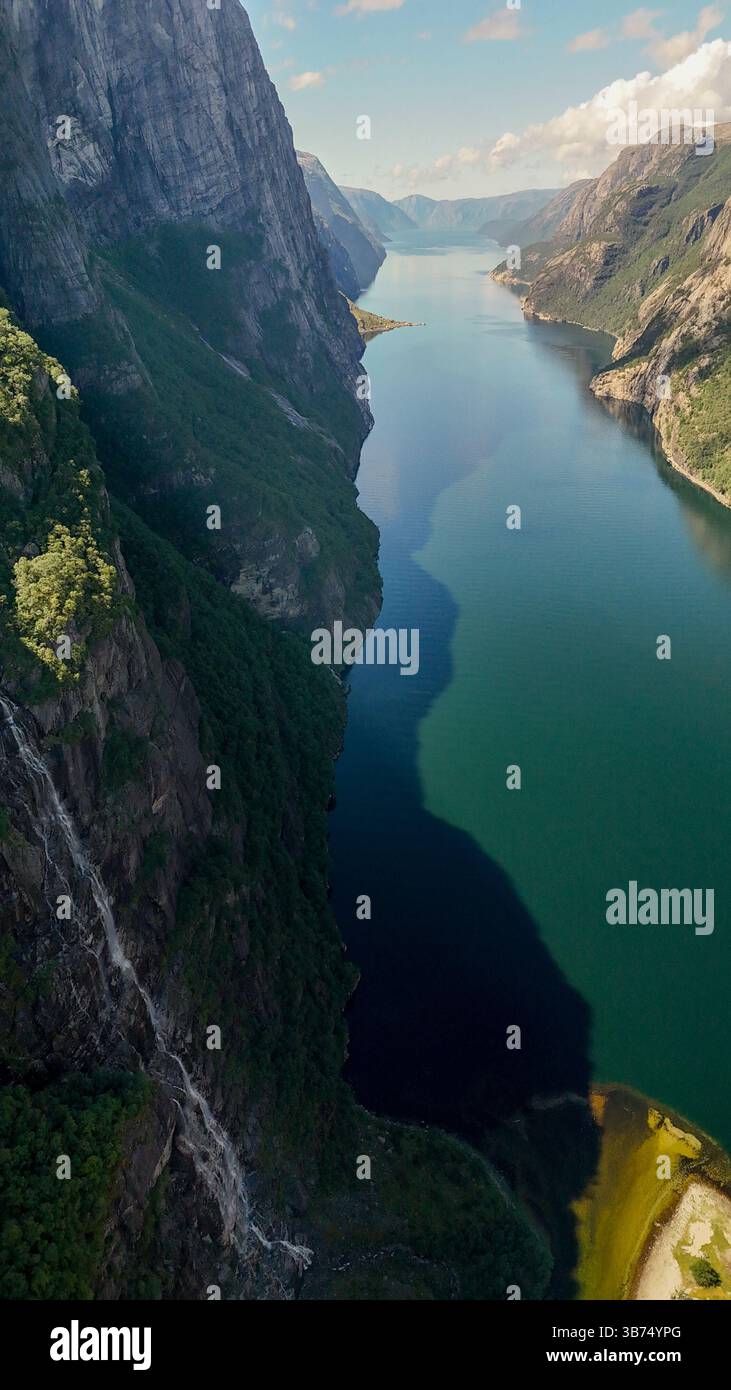 A breathtaking fjord in Lysefjord, Norway, showcases towering cliffs ...
