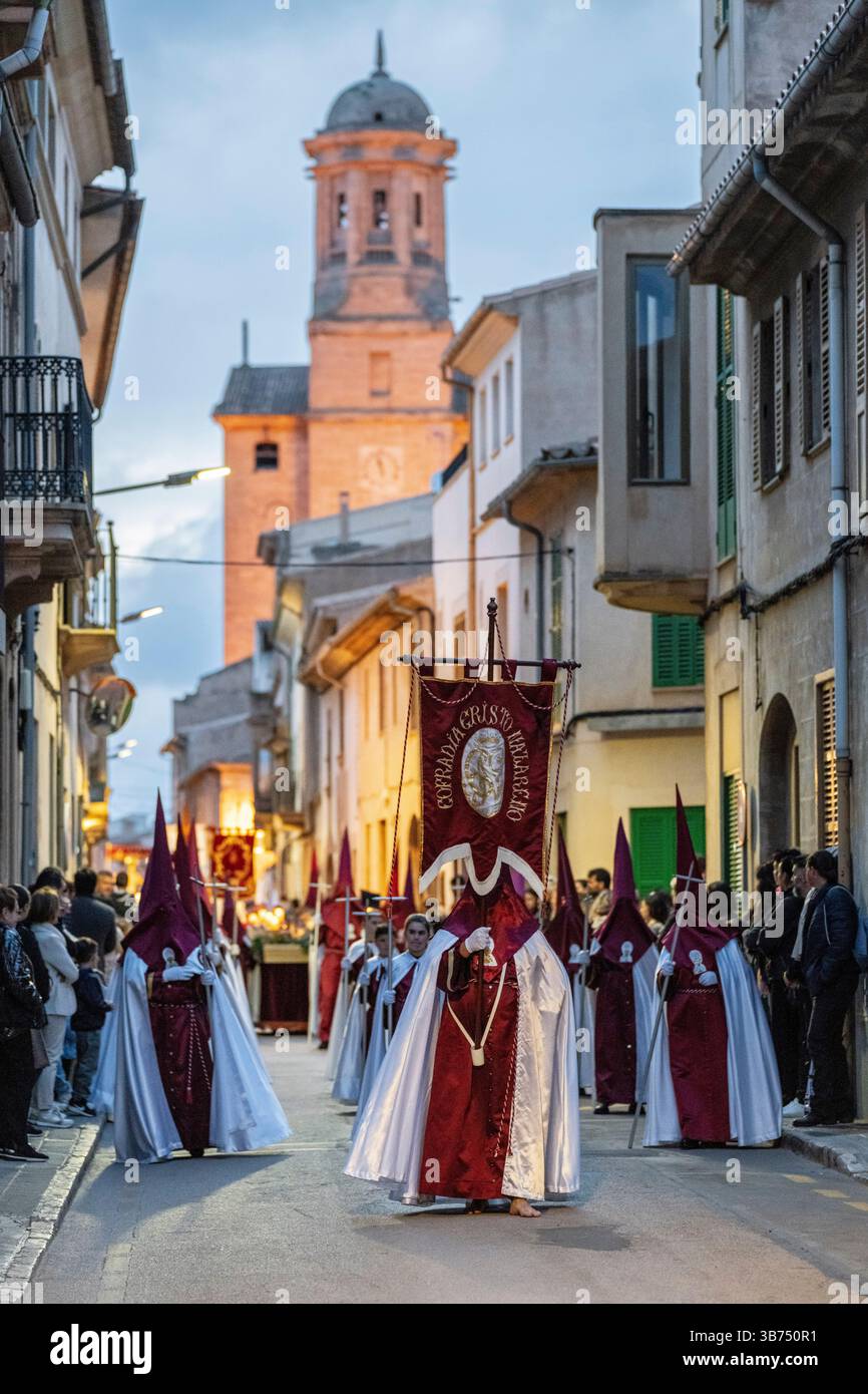 Hooded brothers with conical hats that serve as masks, Holy Week ...