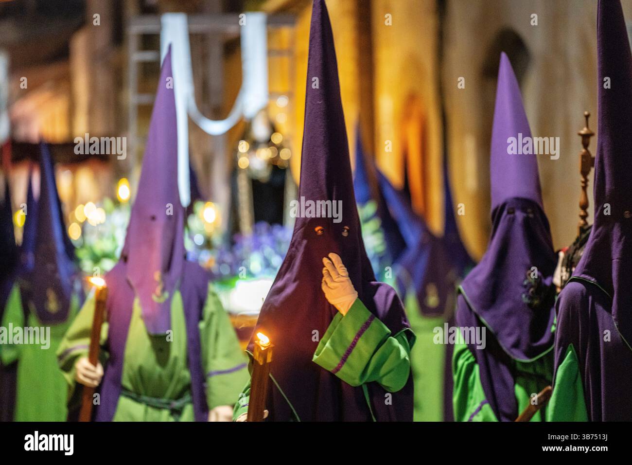 Hooded brothers with conical hats that serve as masks, Holy Week procession, Llucmajor, Mallorca ...