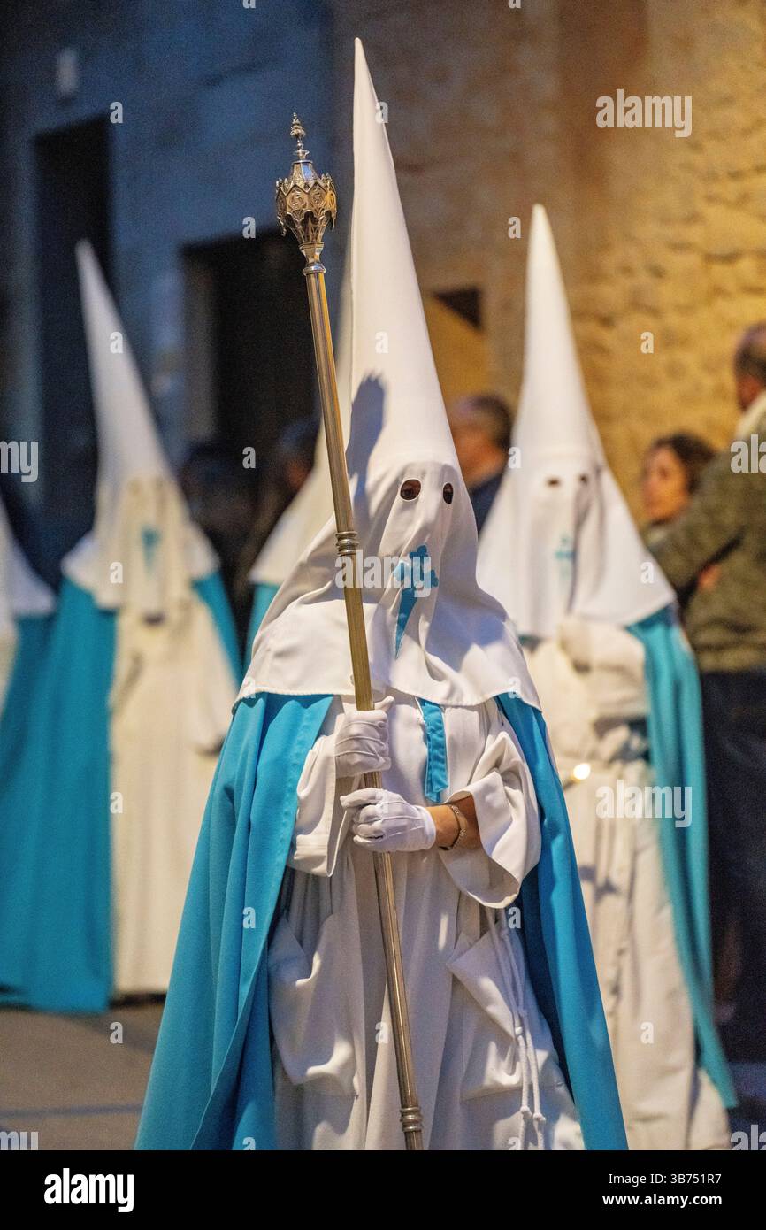 Hooded brothers with conical hats that serve as masks, Holy Week ...