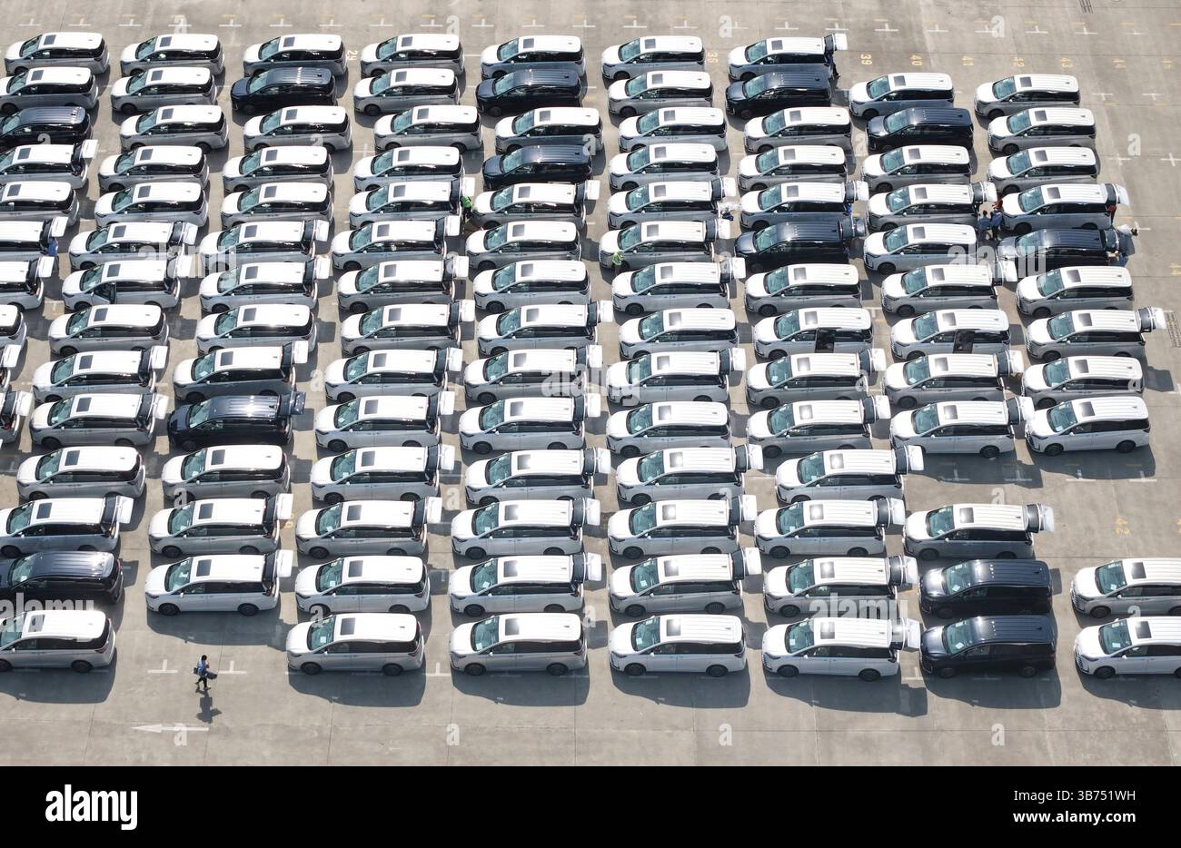 New cars wait for shipment at the logistics center of a plant of SAIC ...