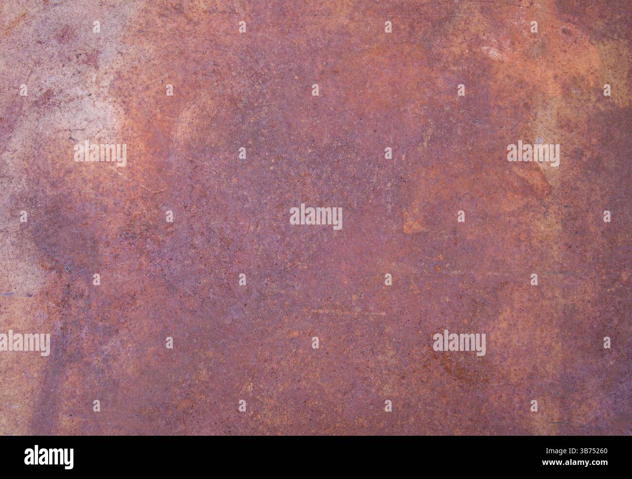 Close-up of a rusty metal sheet with rich, textured corrosion patterns. Industrial background ...