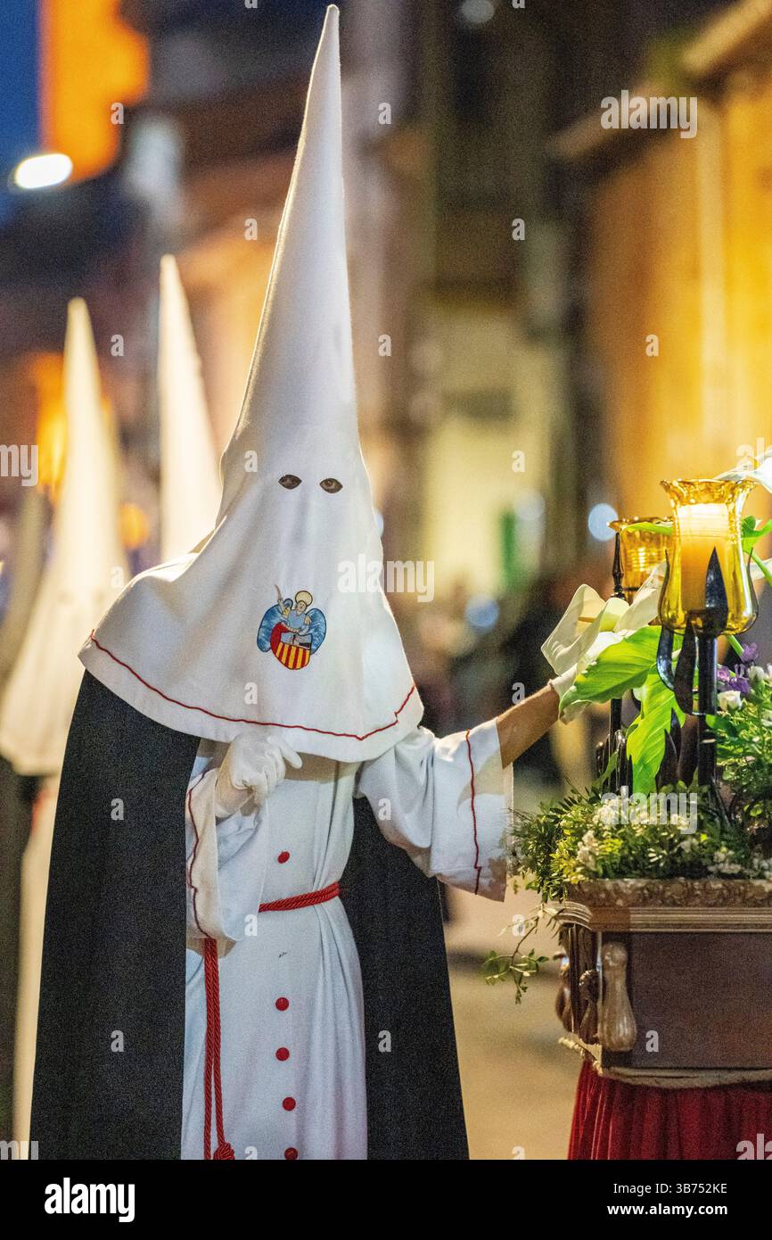 Hooded brothers with conical hats that serve as masks, Holy Week ...