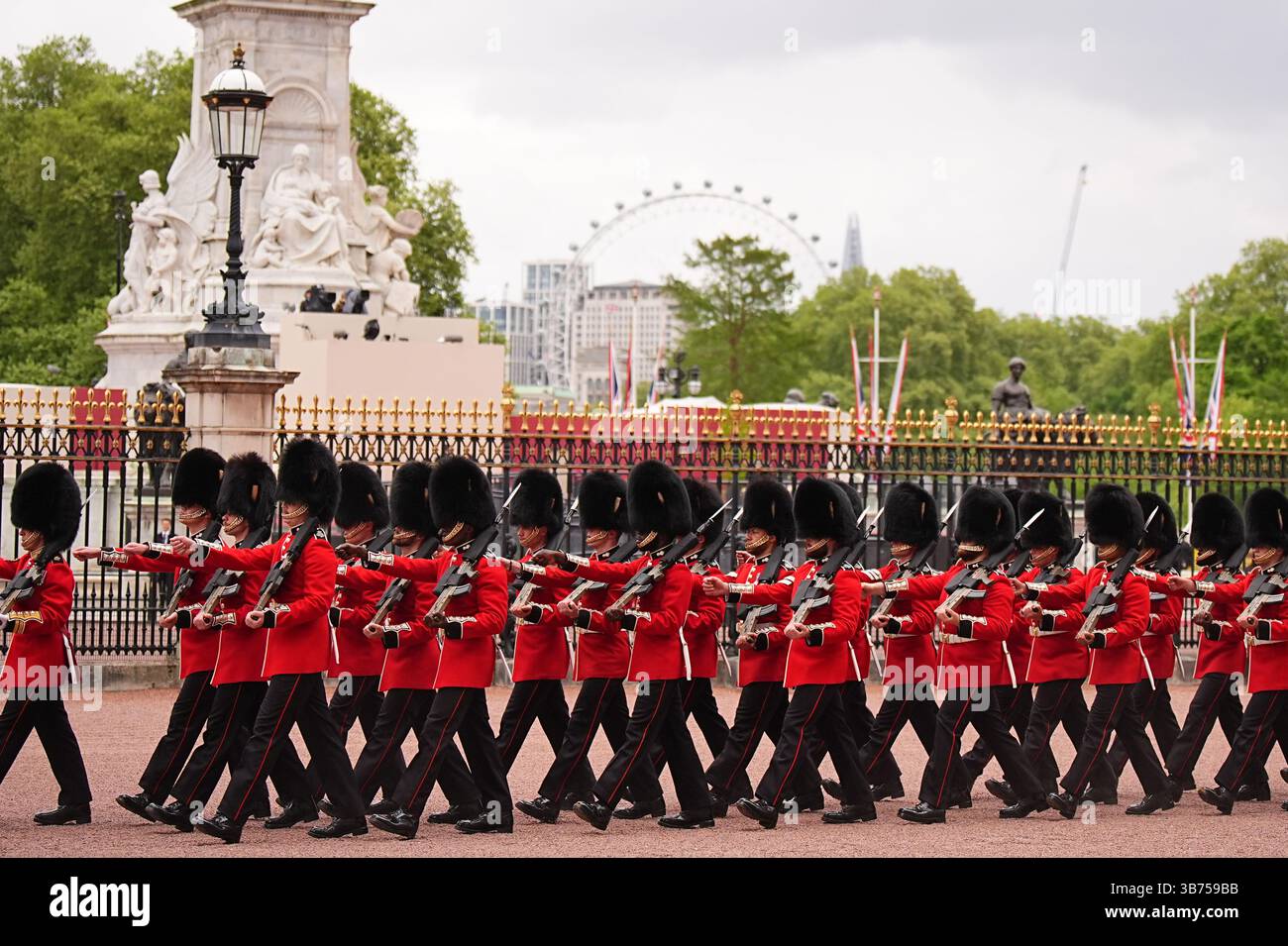 Grenadier Guards march past the Queen Victoria Memorial during a ...
