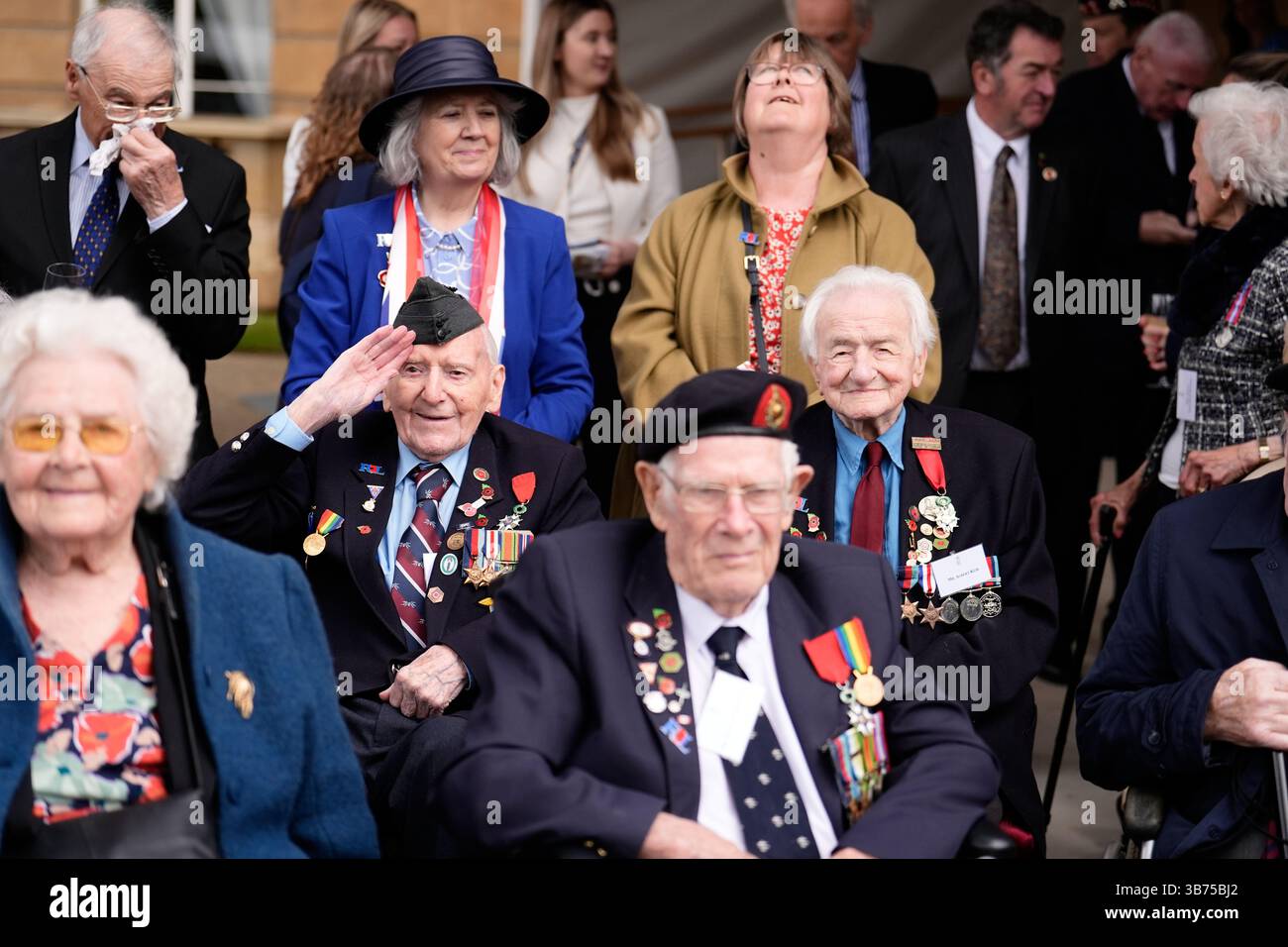 Veterans Bernard Morgan, left saluting, and Albert Keir on the West ...