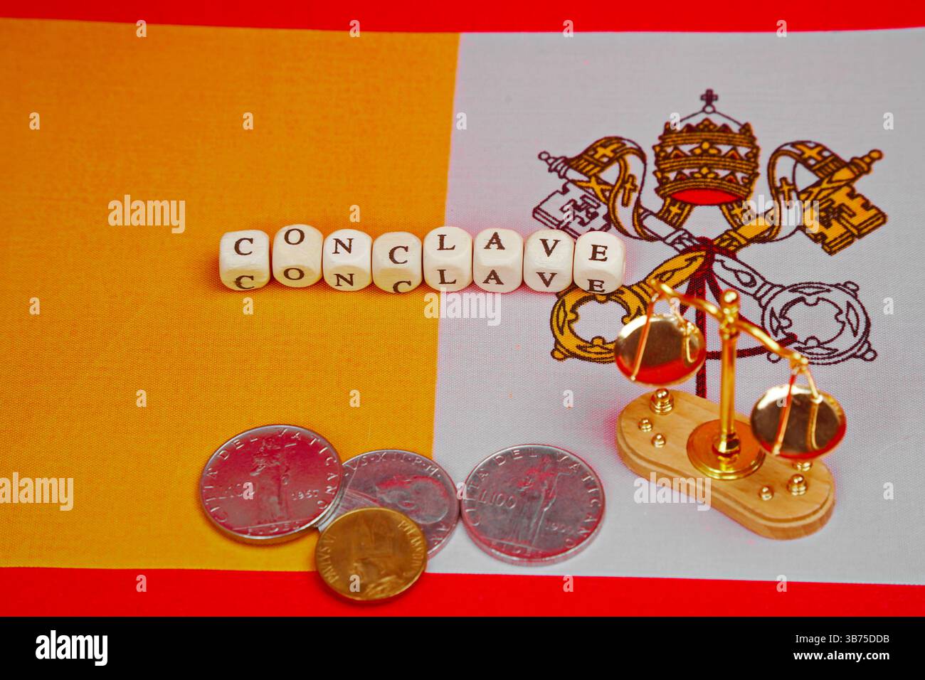 Mini scales and the inscription conclave on the background of the ...