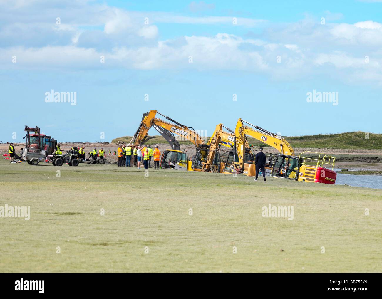 Bridgend County,UK, 05 May 2025 Heavy machinery at the Ogmore River ...