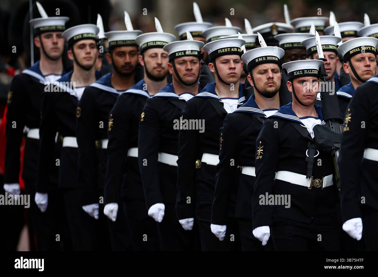 Members of the Royal Navy march down The Mall, during the V-E Day 80th ...